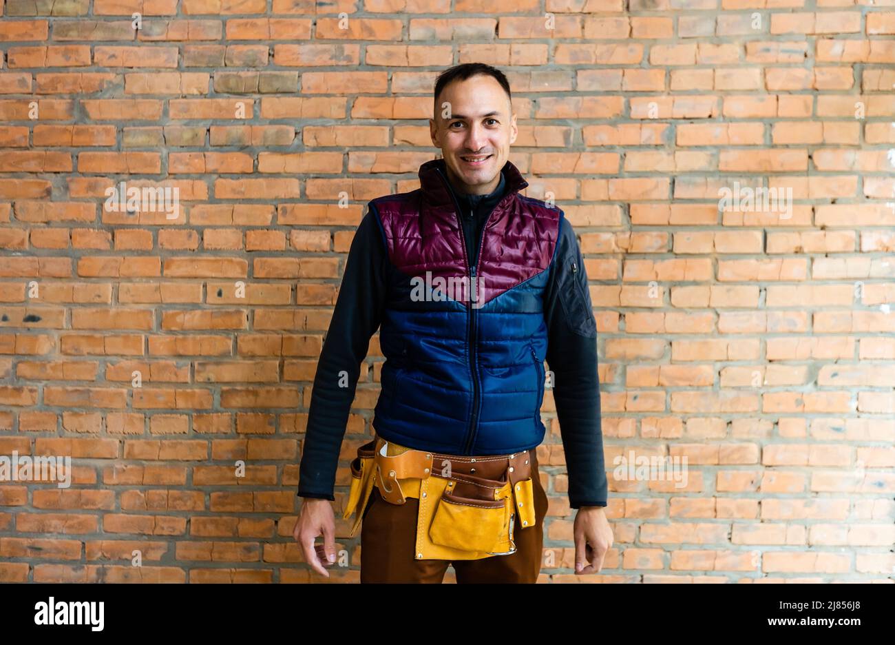 Builder handyman with construction tools. House renovation background ...