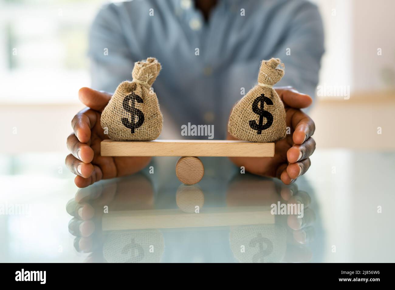Money Balance On Scales. Judicial Law System Stock Photo - Alamy