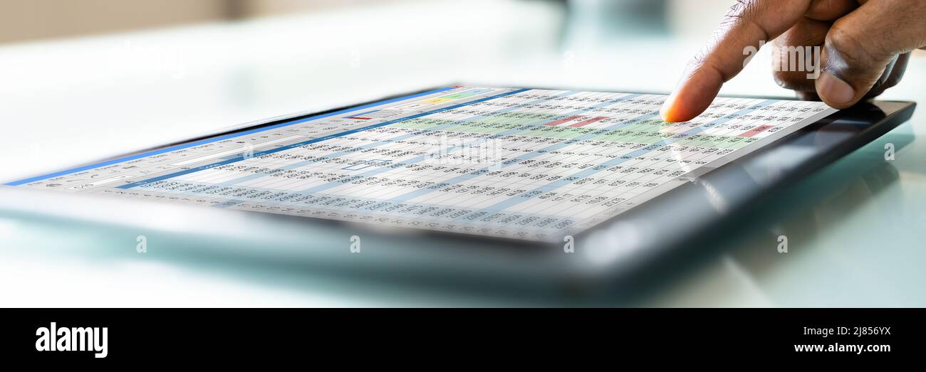 African American Spreadsheet Data Analyst Using Computer Software Stock ...