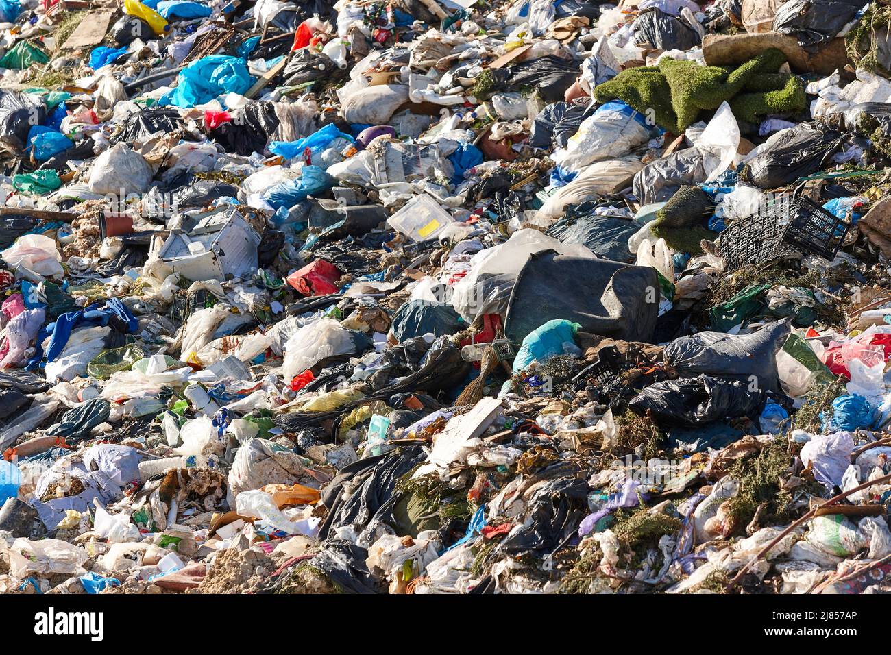 Open air garbage dump. Plastic pollution. Recycling junk. Consumerism ...