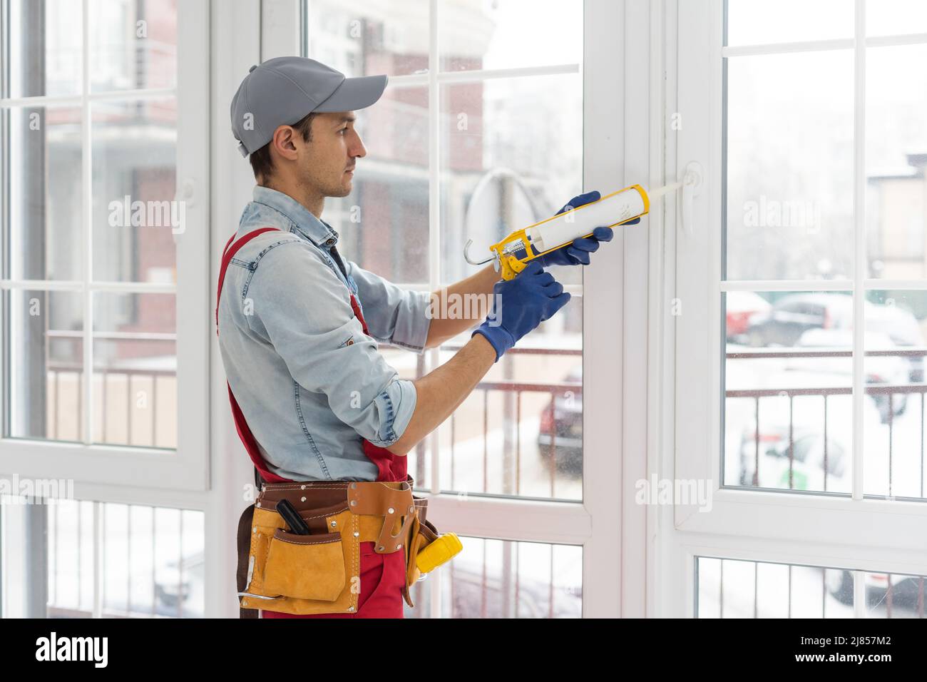 The worker installing and checking window in the house Stock Photo - Alamy