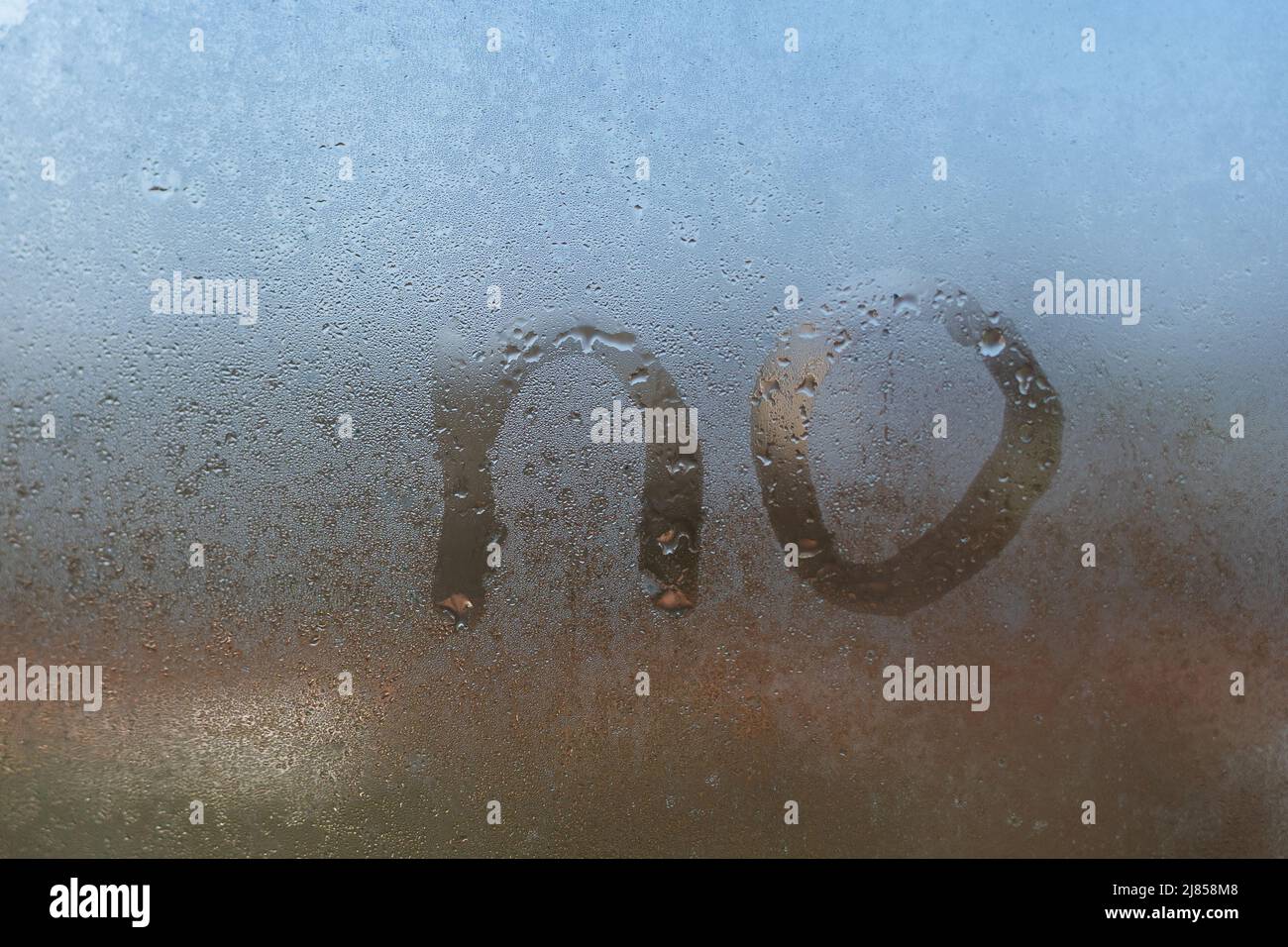 the word no handwritten on night wet window glass surface Stock Photo ...