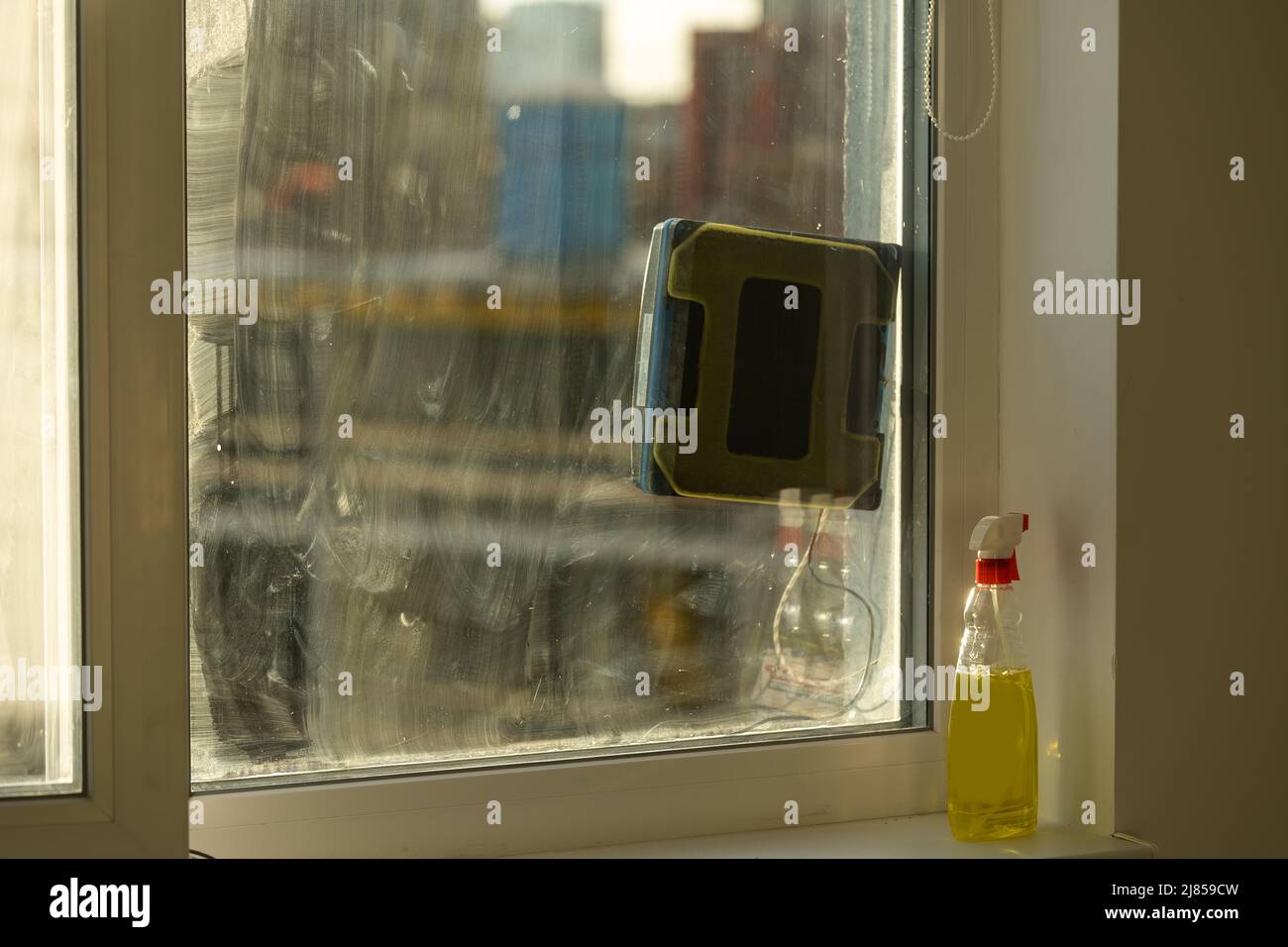 Vacuum cleaner robot cleaning window in high building outdoor Stock ...