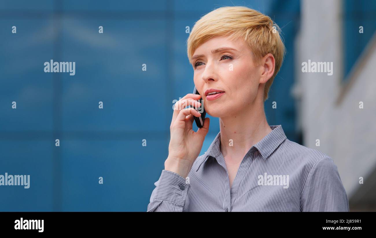 Portrait of adult 40s business woman mature smart lady boss blonde with ...