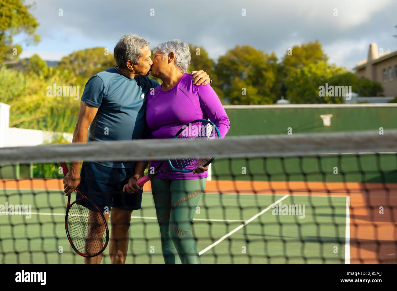 Kissing couple biracial hi-res stock photography and images - Alamy