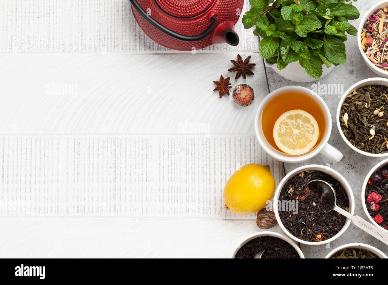 Various dried tea and teapot. Top view flat lay with copy space Stock ...