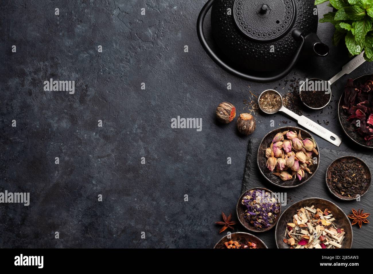 Various dried tea and teapot. Top view flat lay with copy space Stock ...