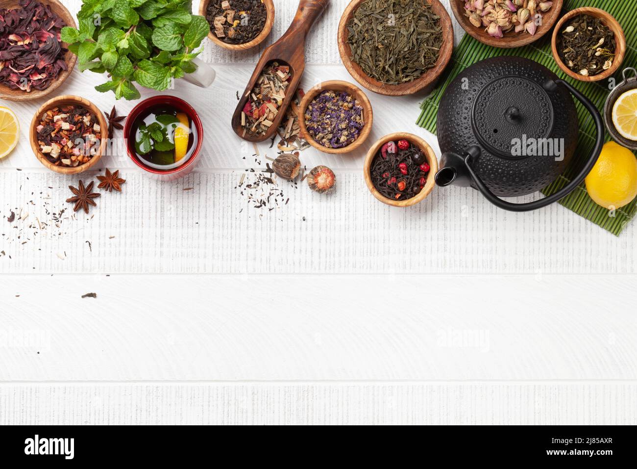 Various dried tea and teapot. Top view flat lay with copy space Stock ...