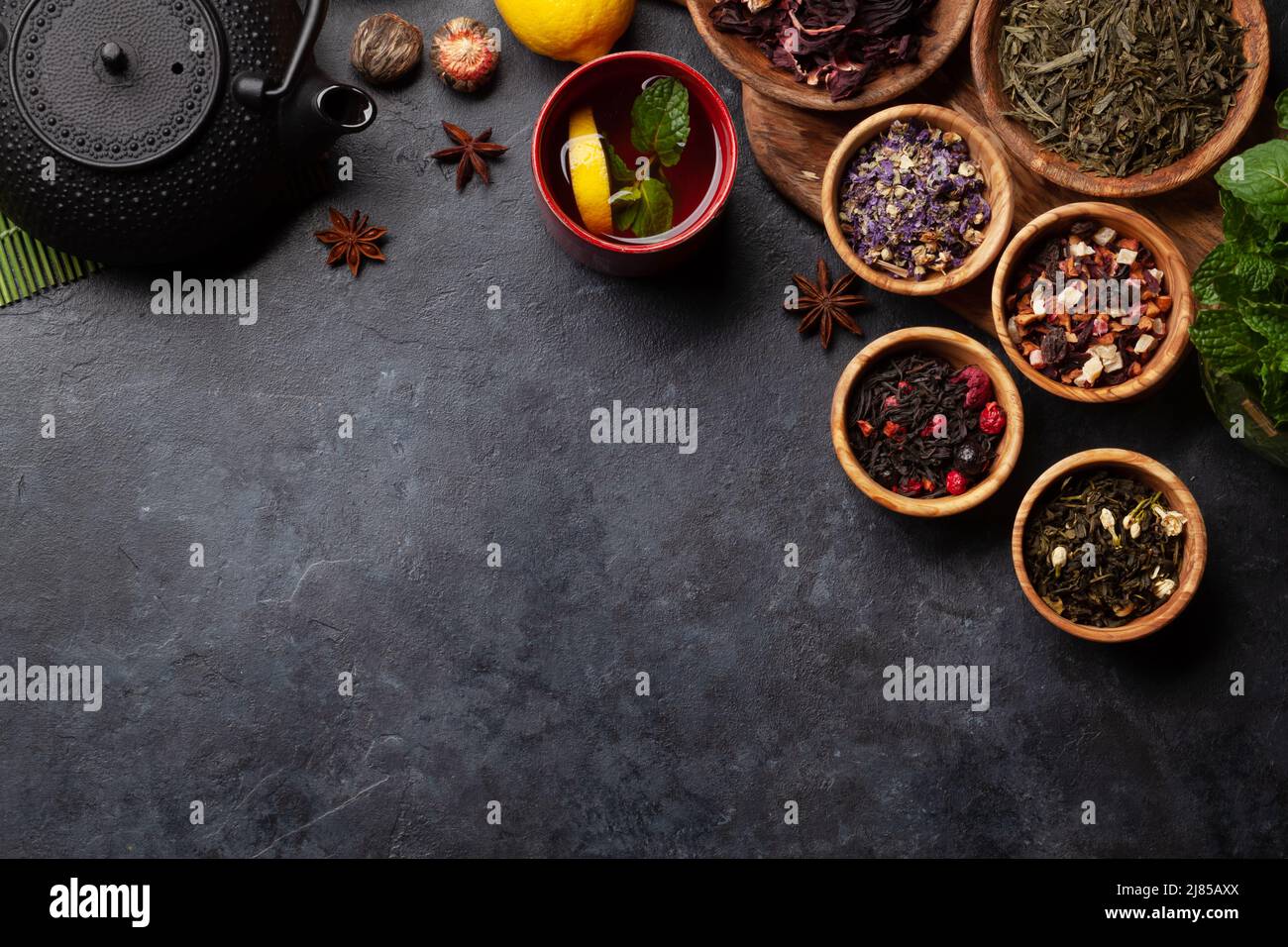 Various dried tea and teapot. Top view flat lay with copy space Stock ...