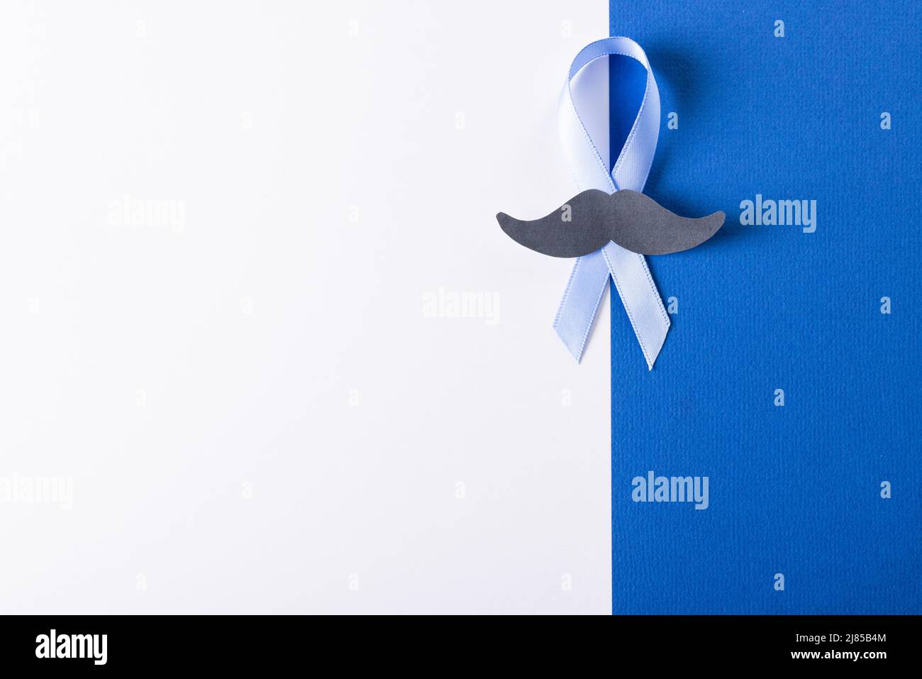 Directly above shot of blue prostate cancer awareness ribbon with ...
