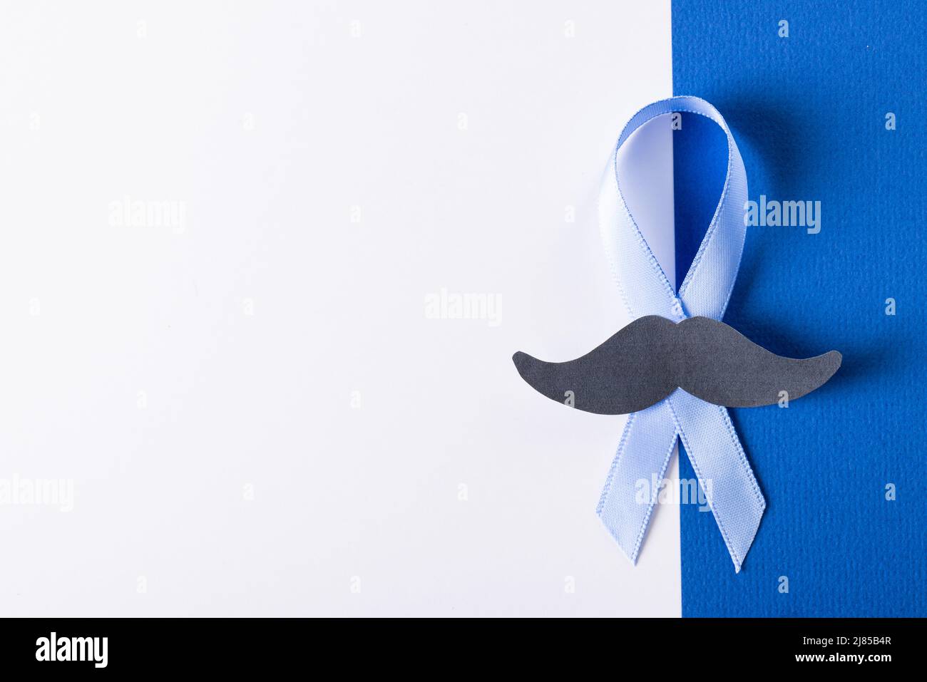 Overhead view of paper mustache with blue prostate cancer awareness ...