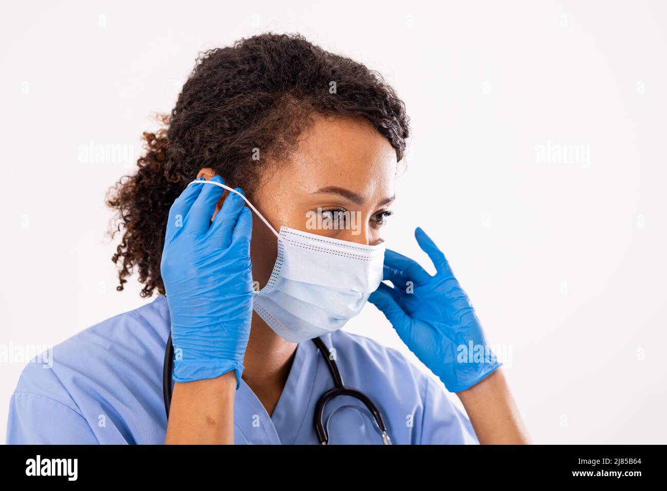 Close-up of african american mid adult female doctor wearing mask ... Close-up of african american mid adult female doctor wearing mask ...