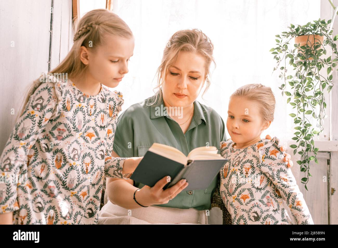 happy family mother with cute little kids daughters girls have fun ...