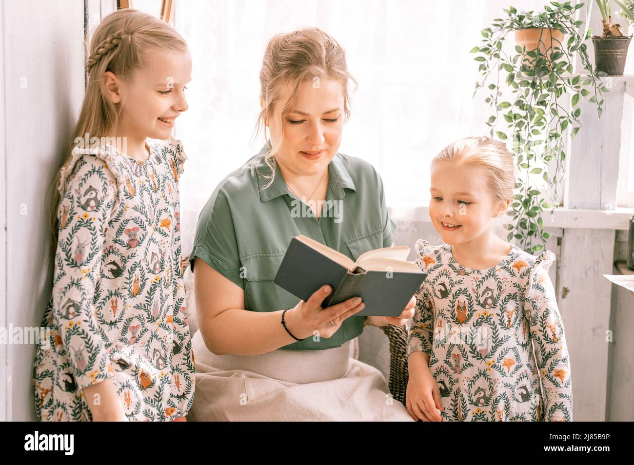 happy family mother with cute little kids daughters girls have fun ...