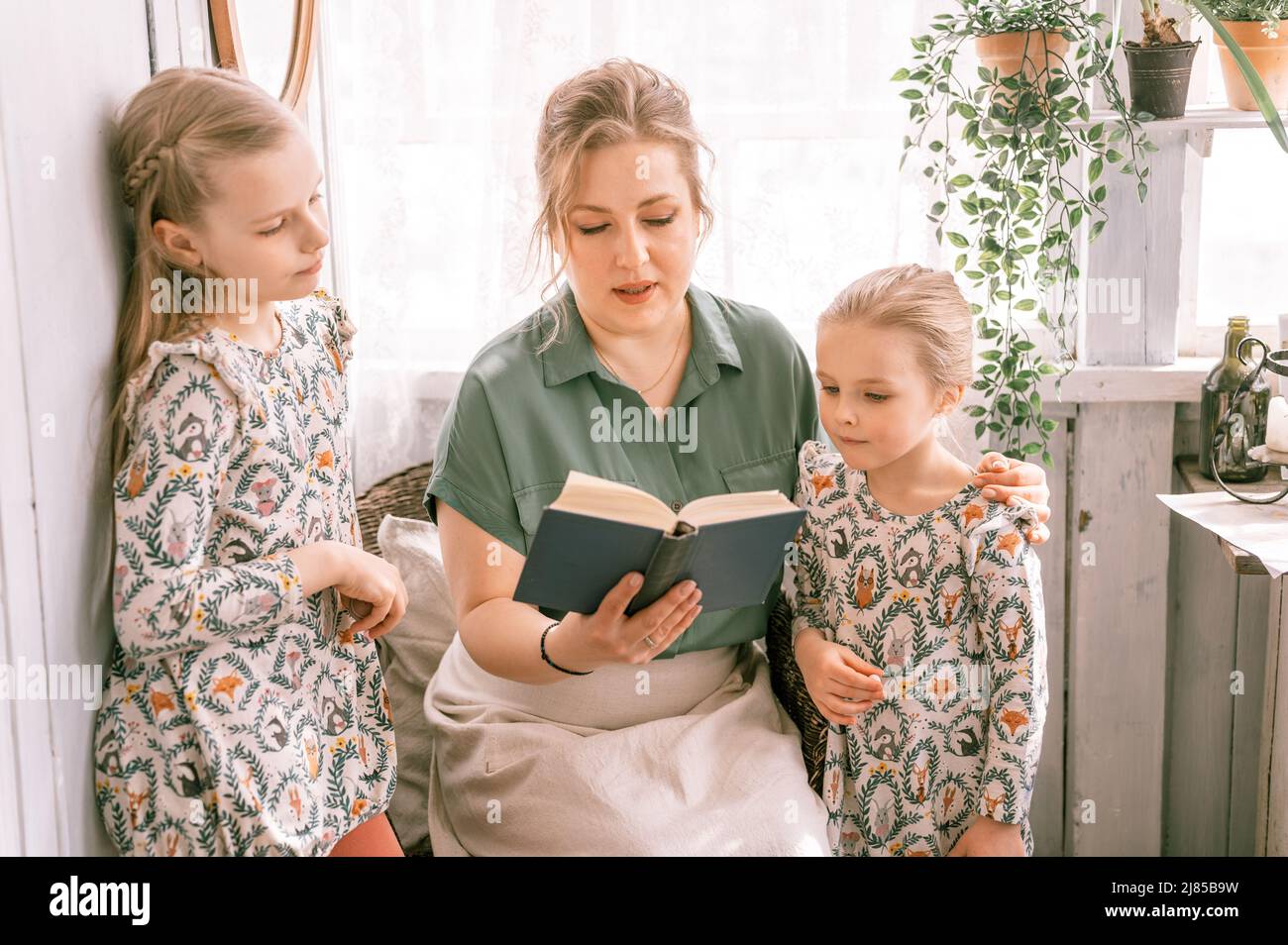 happy family mother with cute little kids daughters girls have fun ...