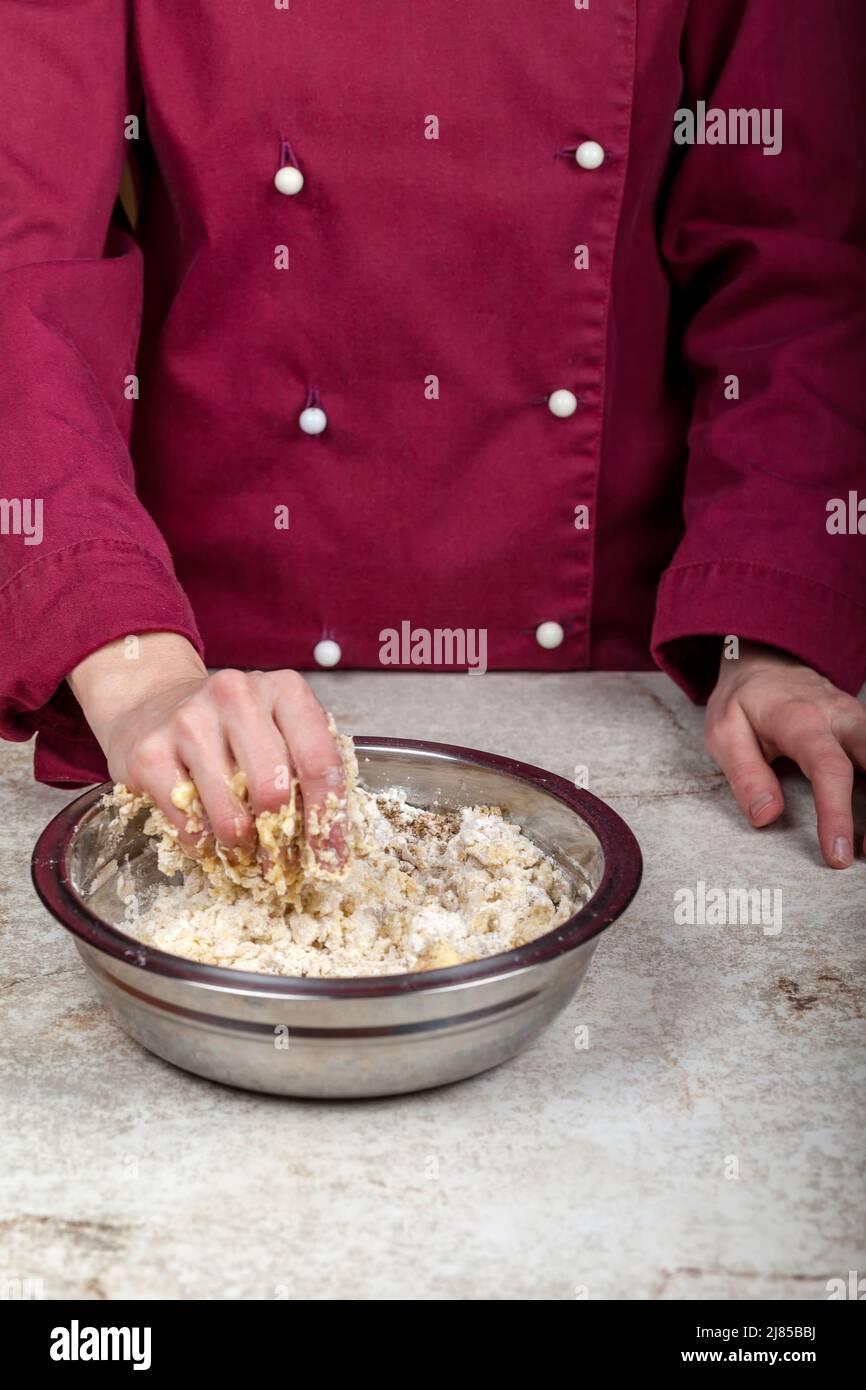 The process of preparing a homogeneous mass of dough for baking Stock ...