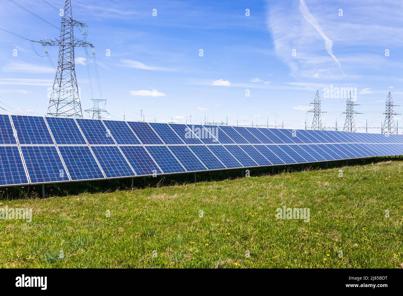 Solar panels, high voltage electricity towers, and transmission power ...