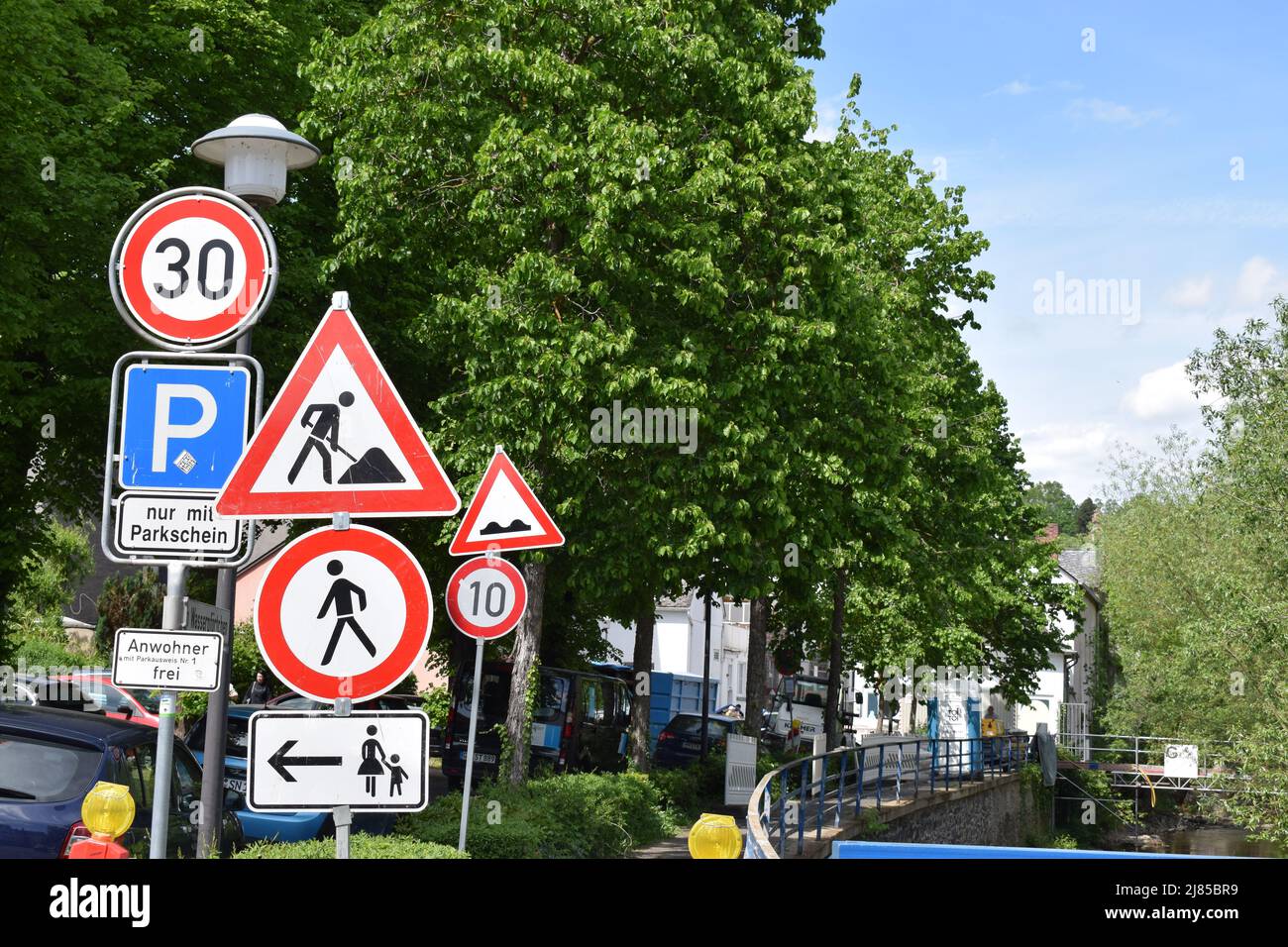 speed limit 10 at road works and bad road plus many other signs Stock ...