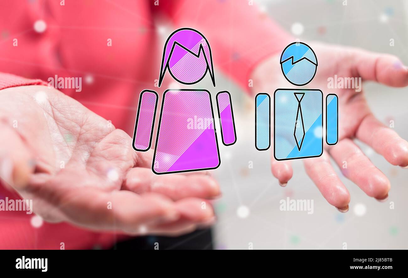 Gender equality concept above the hands of a woman in background Stock ...