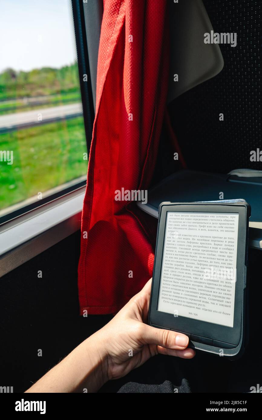 reading book in bus road trip concept Stock Photo - Alamy