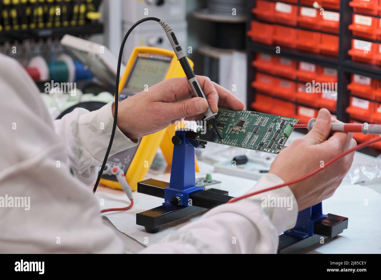 Technician tin soldering circuit board of electronic device Stock Photo - Alamy
