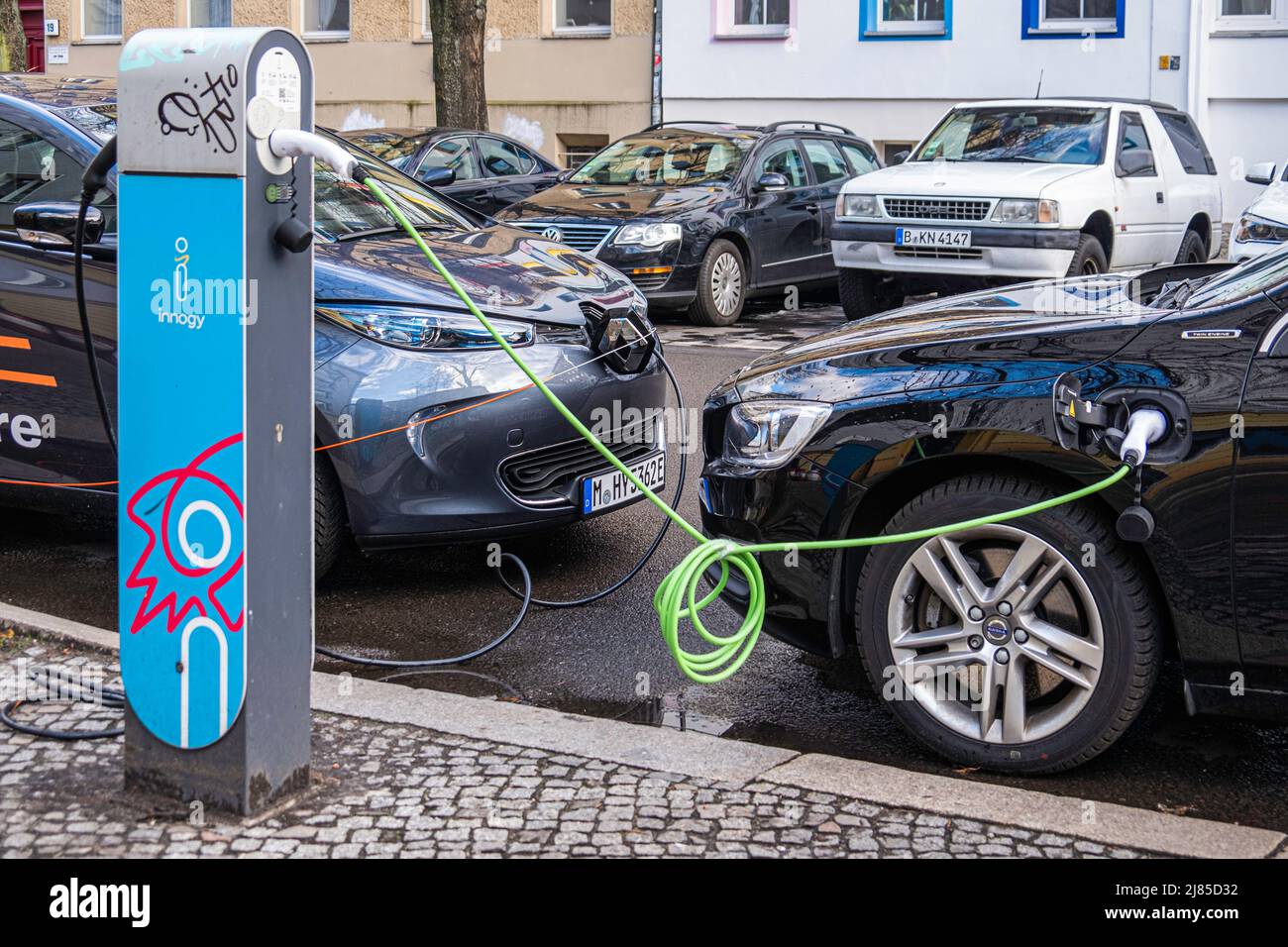 Berlin,Germany. Two cars charging at Innogy electric charging point ...