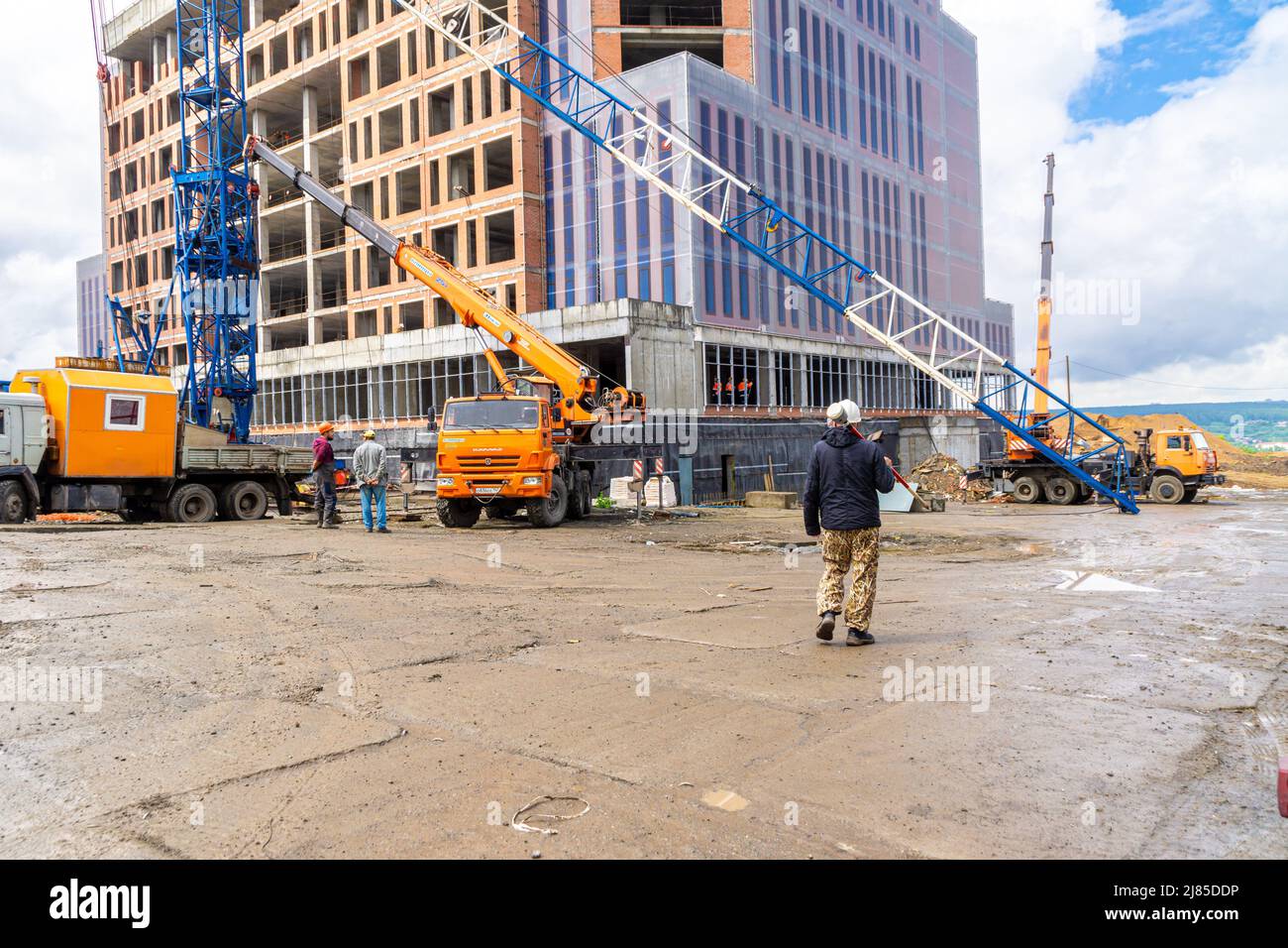 Kemerovo, Russia - June 22, 2021. Work at construction site: finishing ...