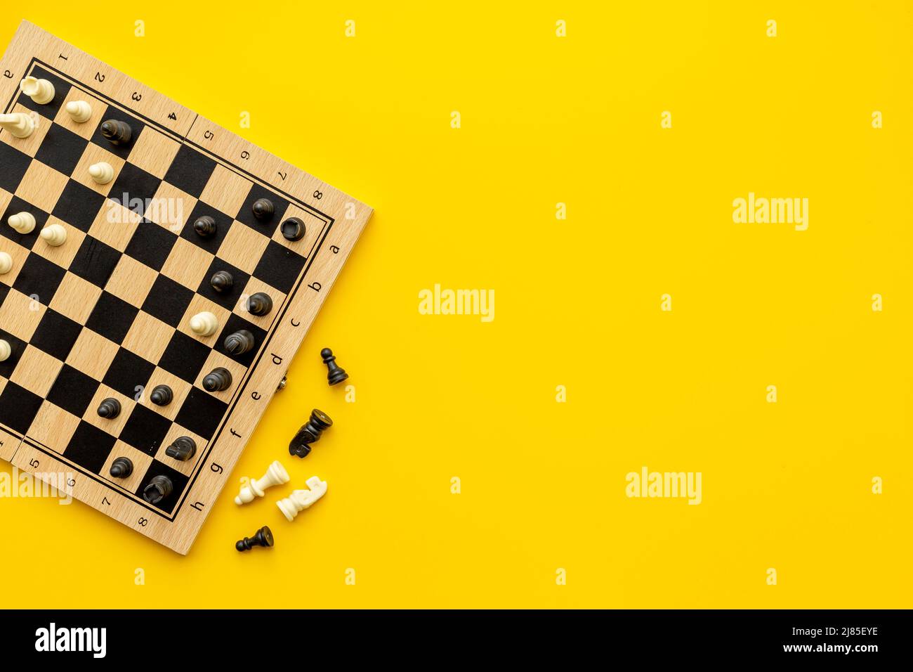 Chess pieces battle on chessboard. Teamwork concept Stock Photo - Alamy