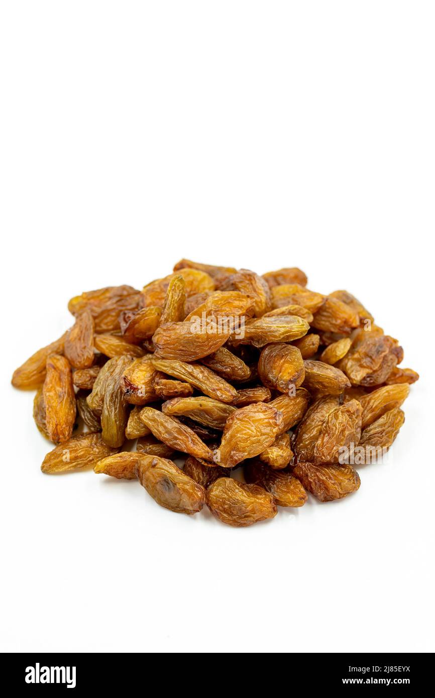 Dried raisins on a white background. Raw grapes and raisins. Healthy ...