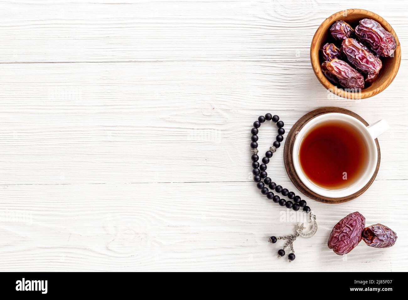 Islamic rosary with dates and tea. Ramadan Kareem concept Stock Photo ...