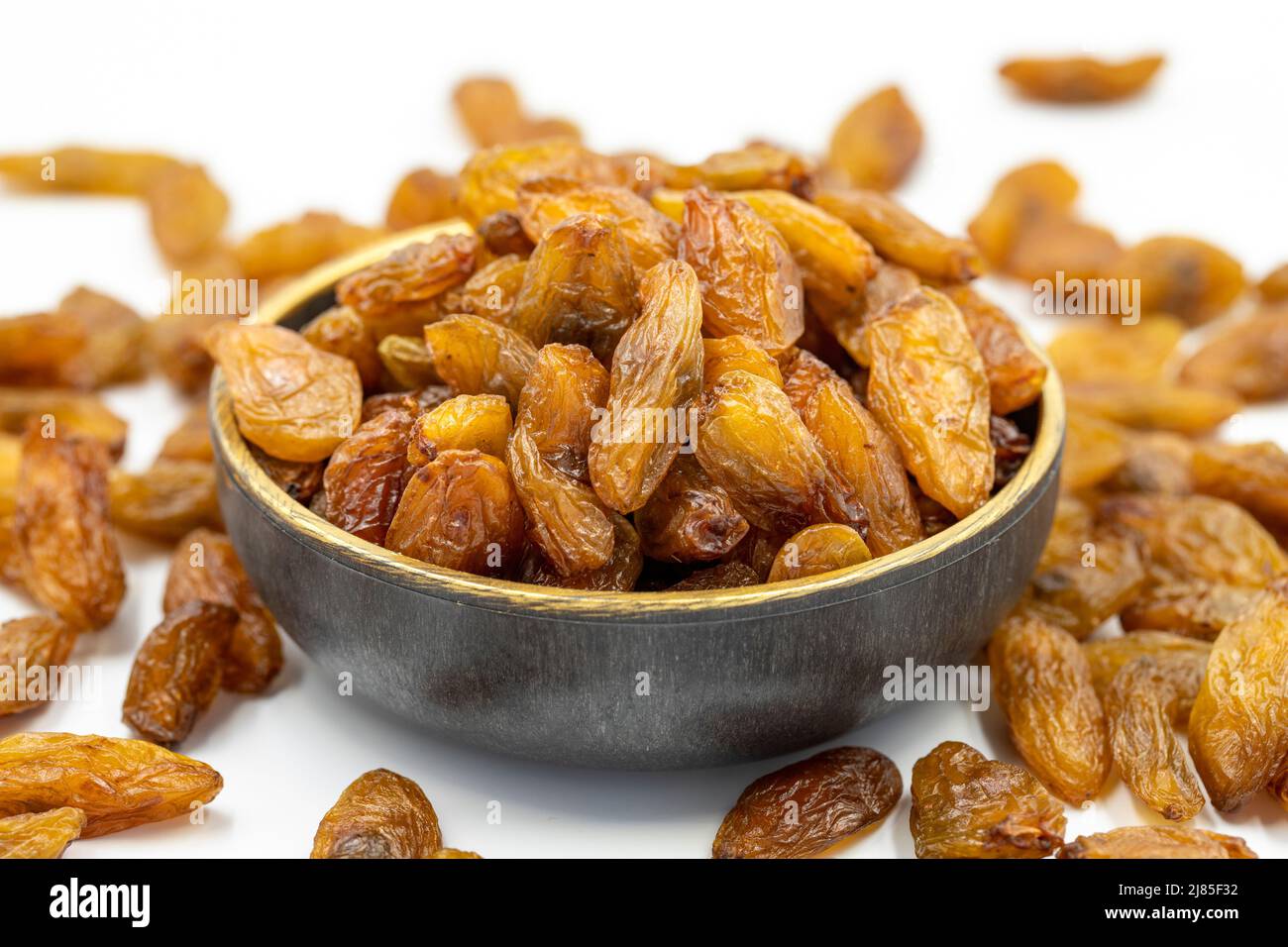 Dried raisins on a white background. Raw grapes and raisins. Healthy ...