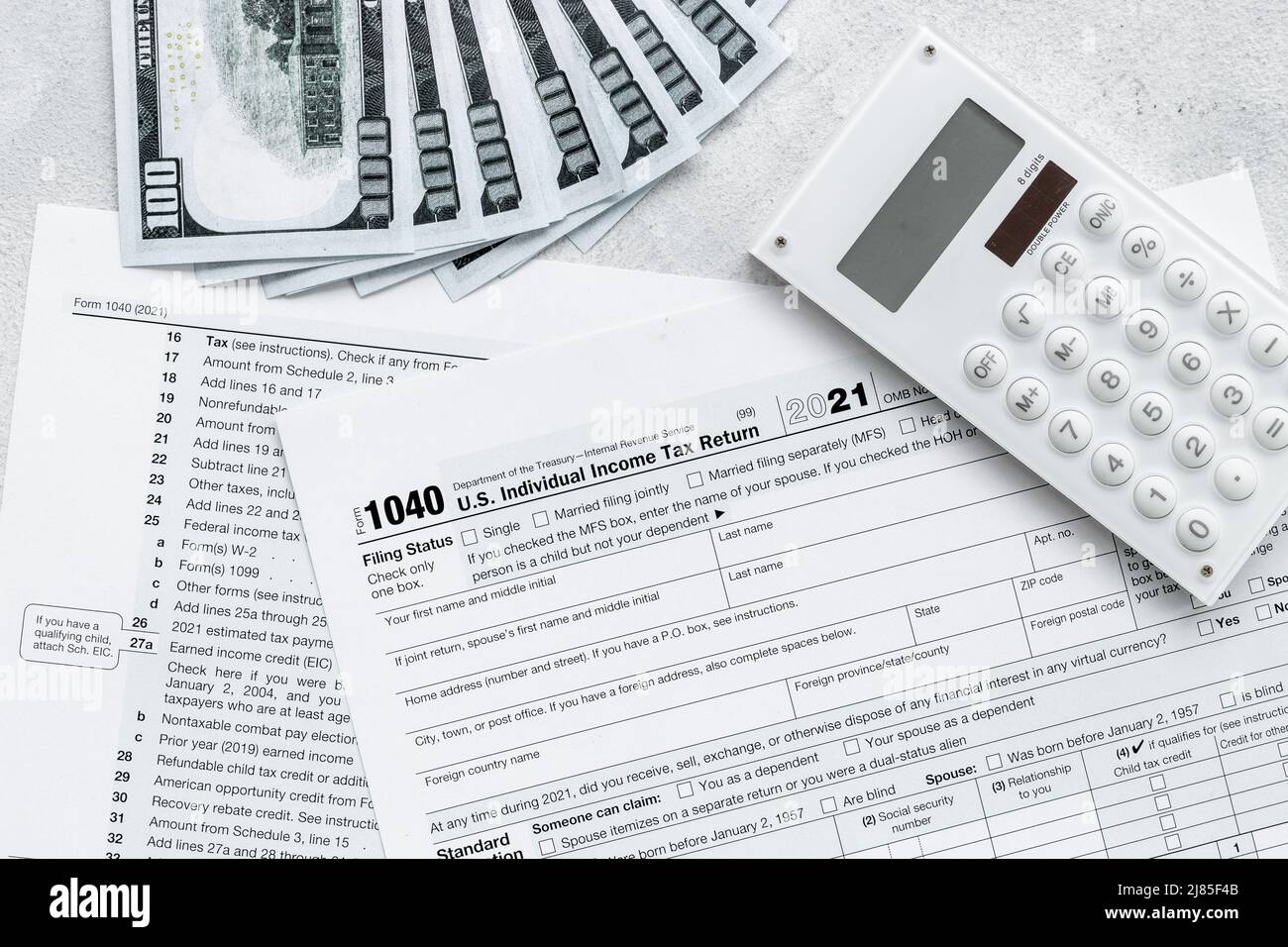 Annual tax form under US law with culculator. Tax payment concept Stock ...