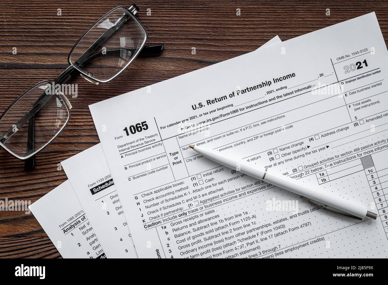 Accountant culculate taxes - US tax form on office table desktop Stock ...