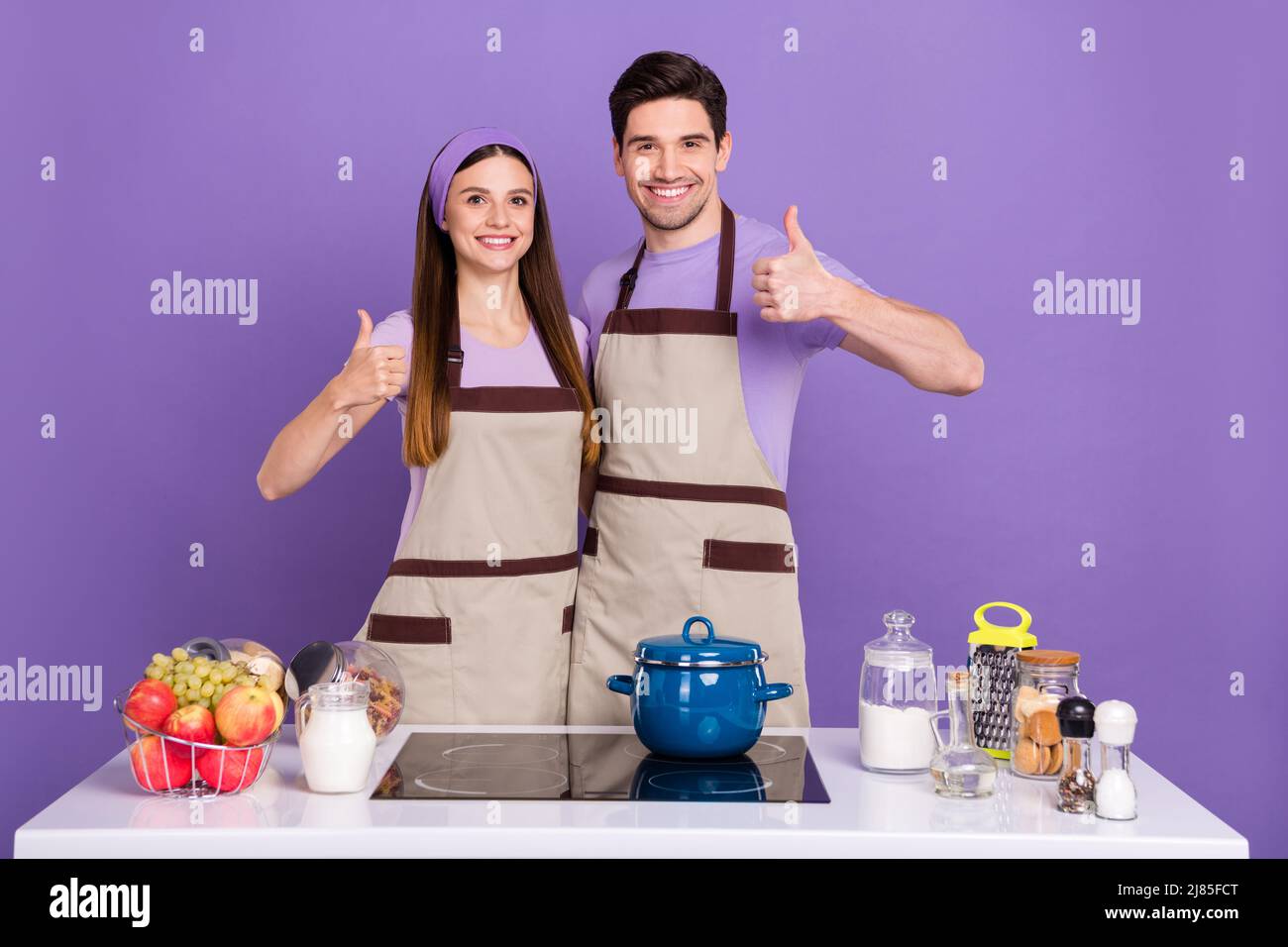 Photo of funky confident boyfriend girlfriend dressed chef showing two ...