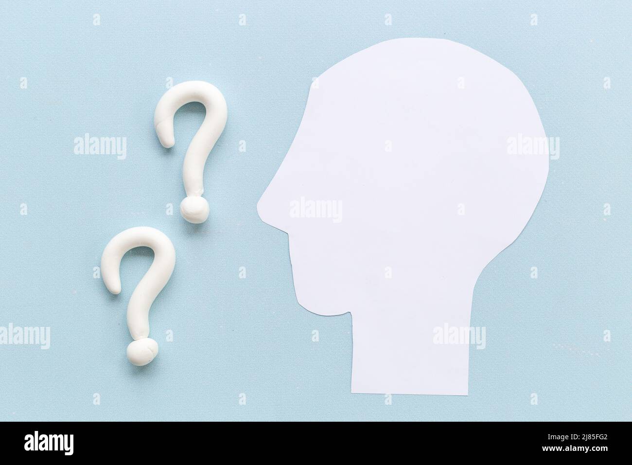 Question mark sign with paper human head. FAQ and help concept Stock ...