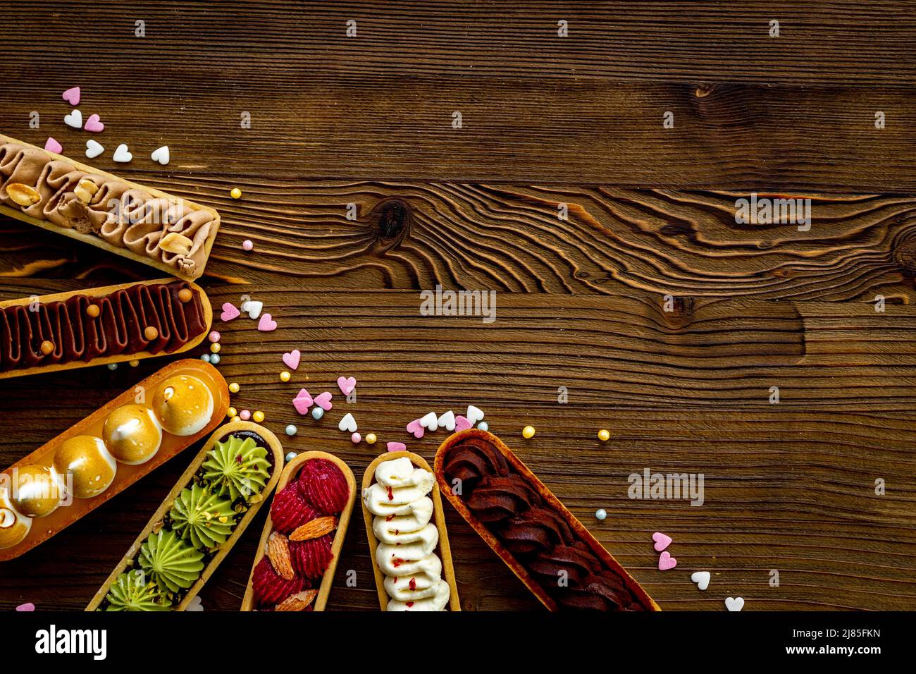 Bakery banner background of eclairs colorful topping Stock Photo - Alamy