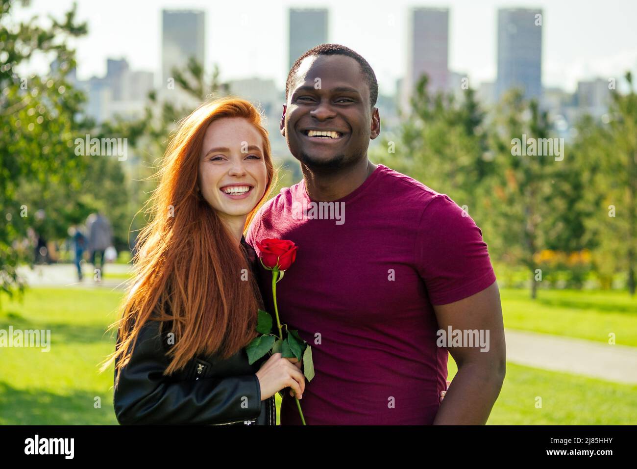 Cheerful multiethnic couple holding hi-res stock photography and images ...