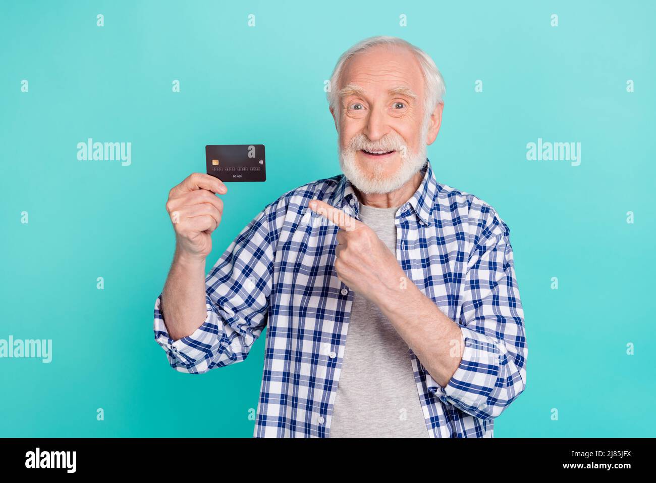 Portrait of cheerful person indicate finger plastic debit card isolated ...