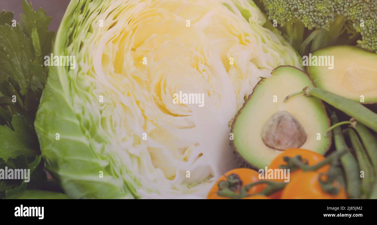 Image of green light bulb over vegetables Stock Photo - Alamy