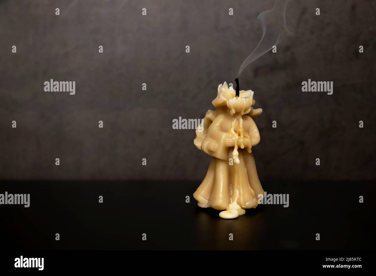 Wax candle, Yellow candle in the form of an extinguished angel ...