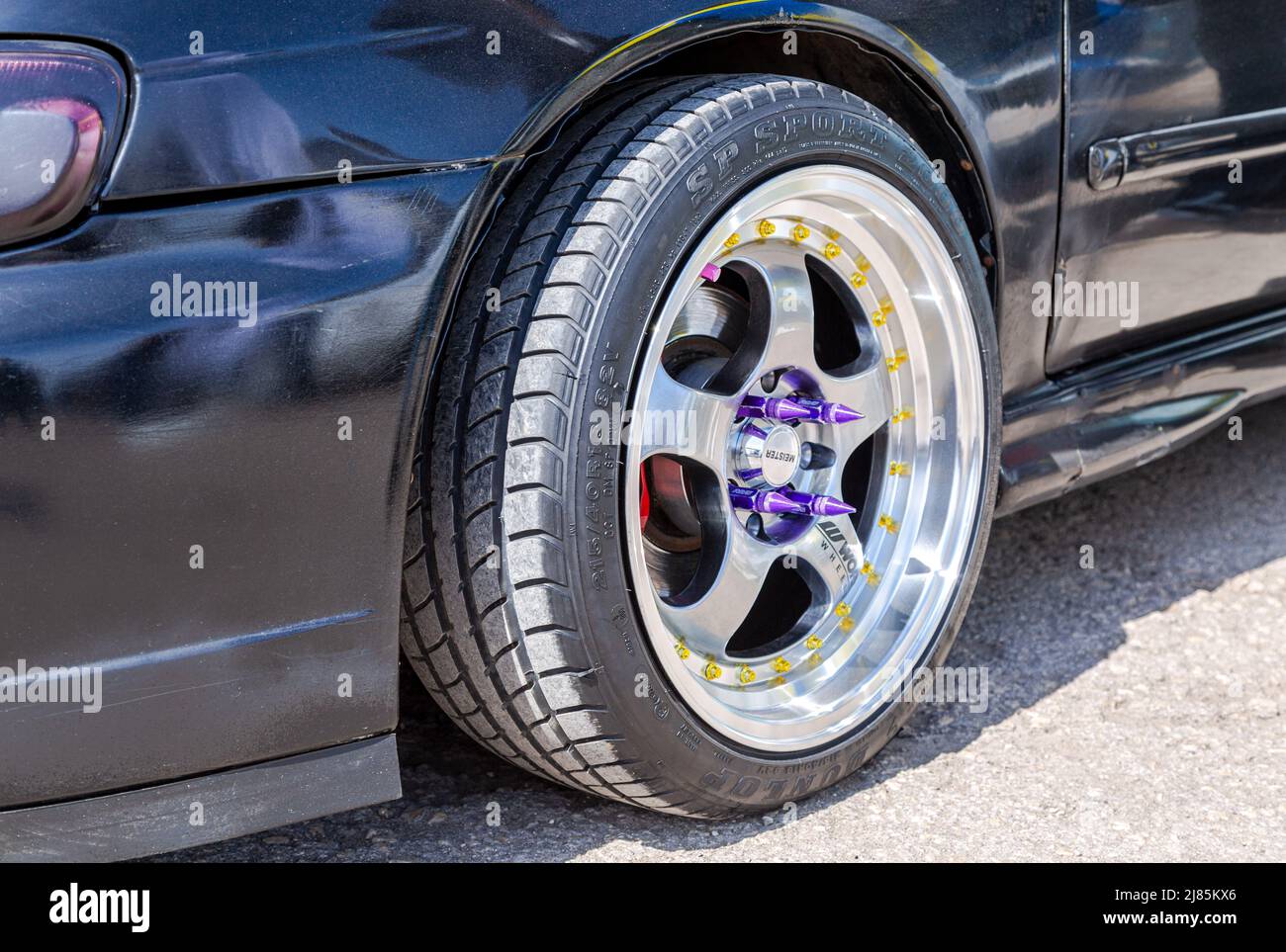 Samara, Russia - May 8, 2022: Modern car wheel with light alloy disc and Dunlop low profile tire ...