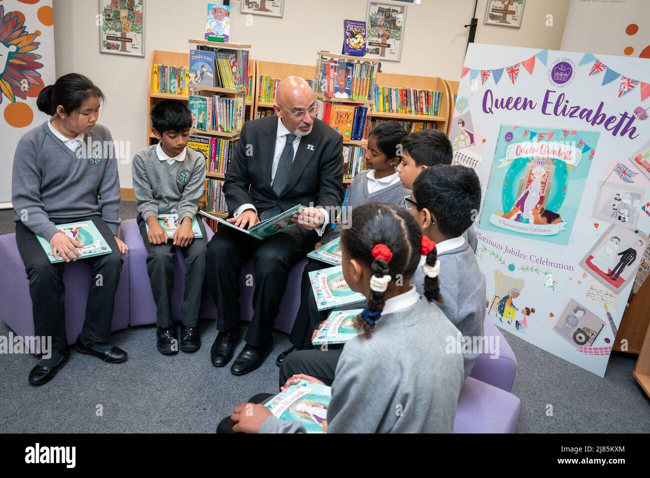 Education Secretary Nadhim Zahawi reads the commemorative Jubilee book ...