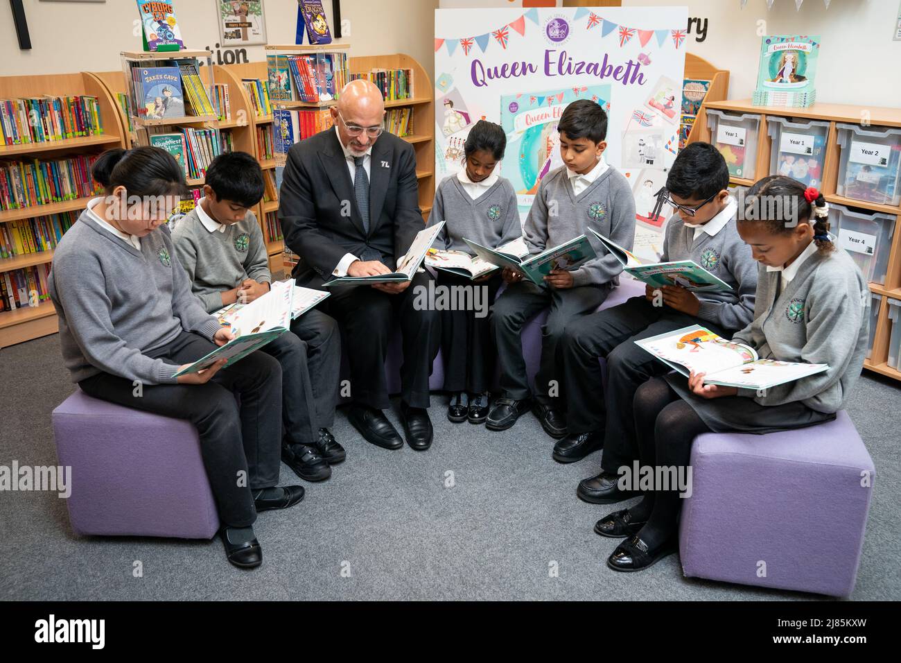 Education Secretary Nadhim Zahawi reads the commemorative Jubilee book ...
