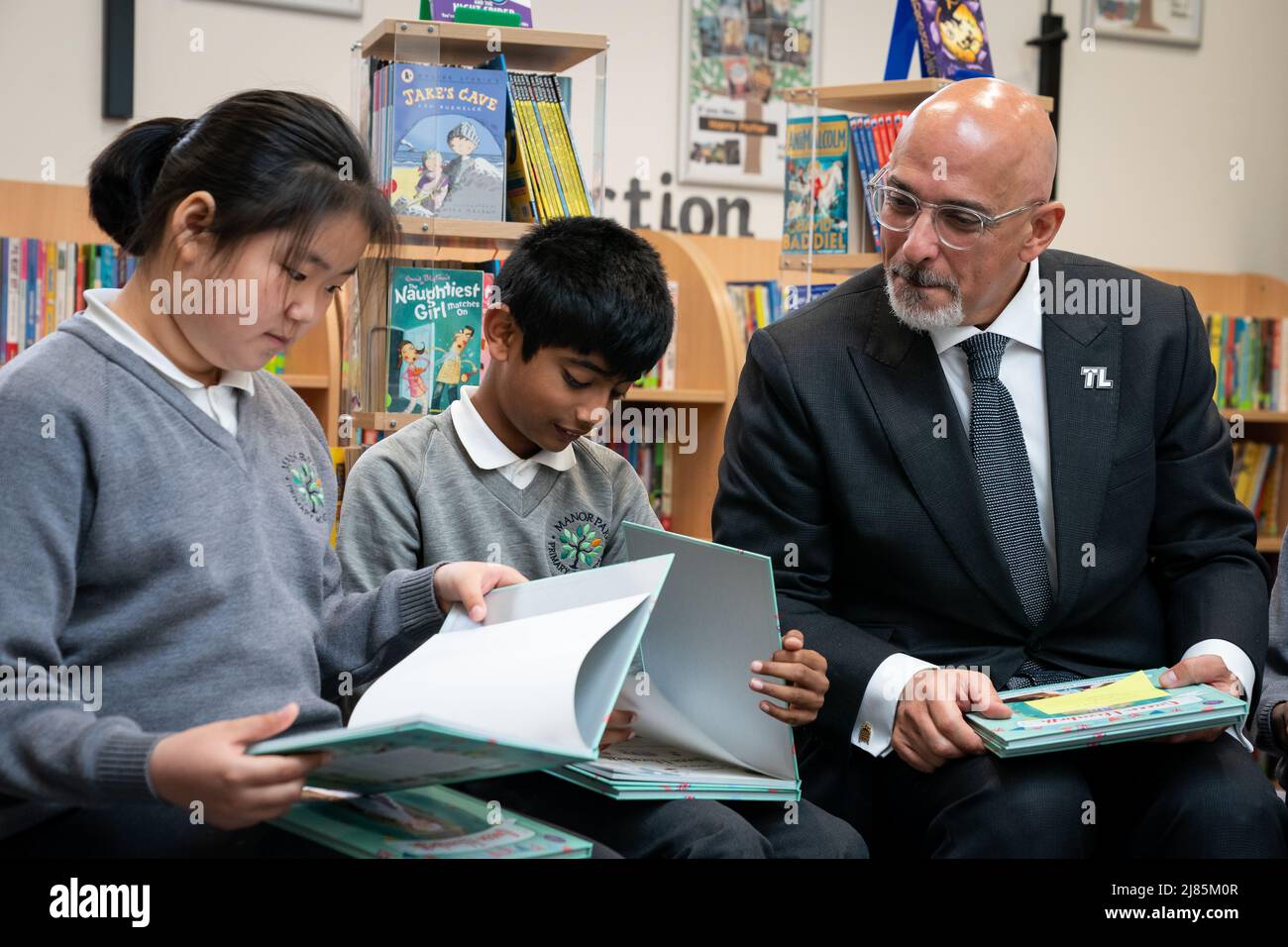 Education Secretary Nadhim Zahawi reads the commemorative Jubilee book ...