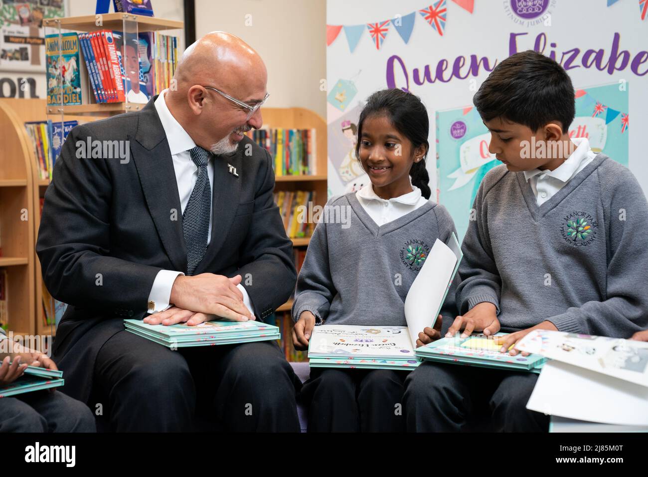 Education Secretary Nadhim Zahawi reads the commemorative Jubilee book ...
