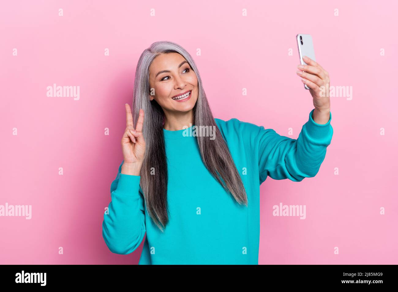 Photo of positive person make selfie hand fingers demonstrate v-sign ...
