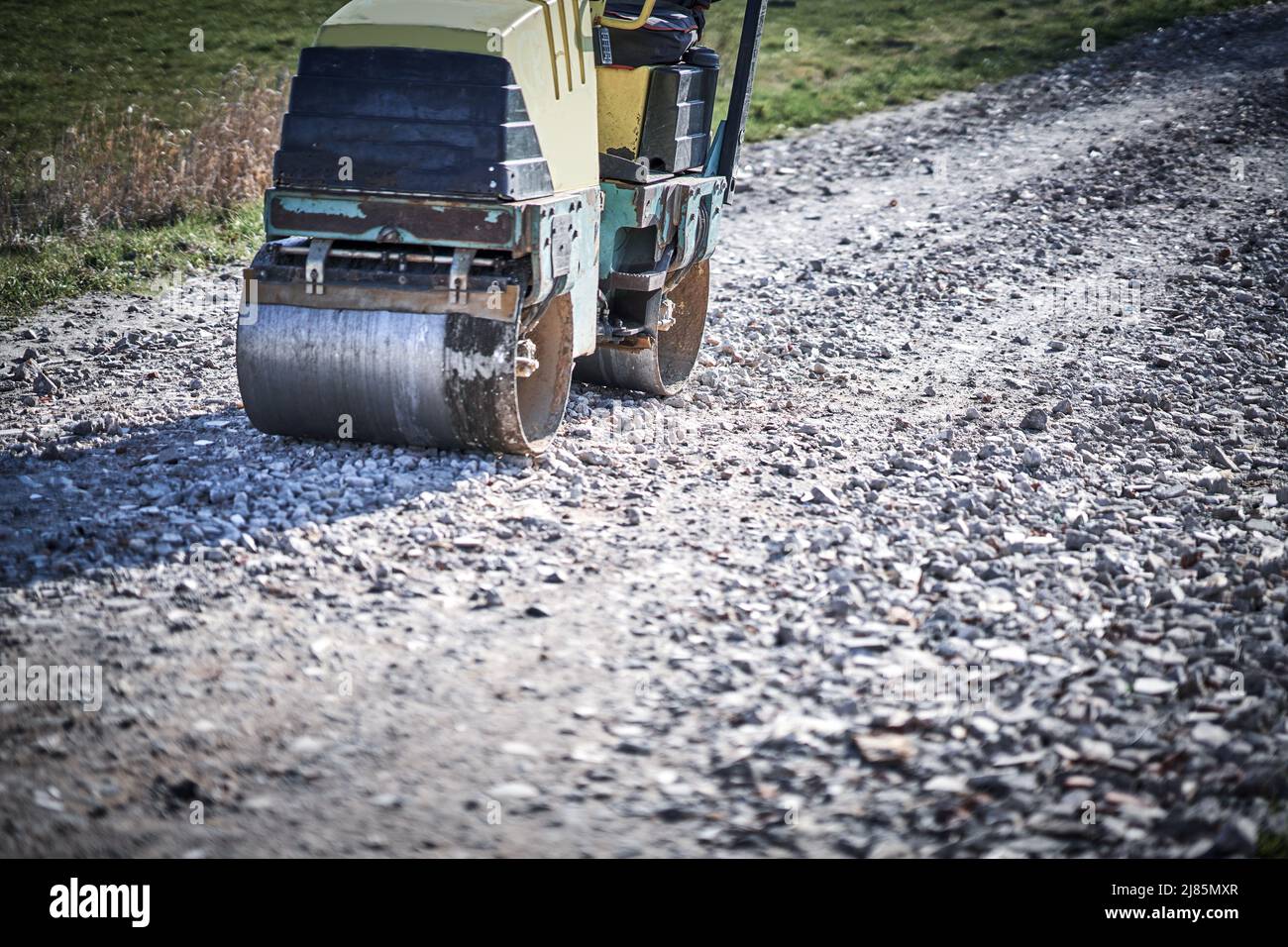 Picture of a road roller machine on the different surfaces Stock Photo ...
