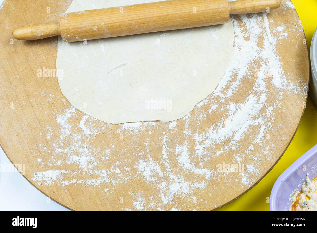 Rolling pins and traditional circle wooden board, ingredients in the ...