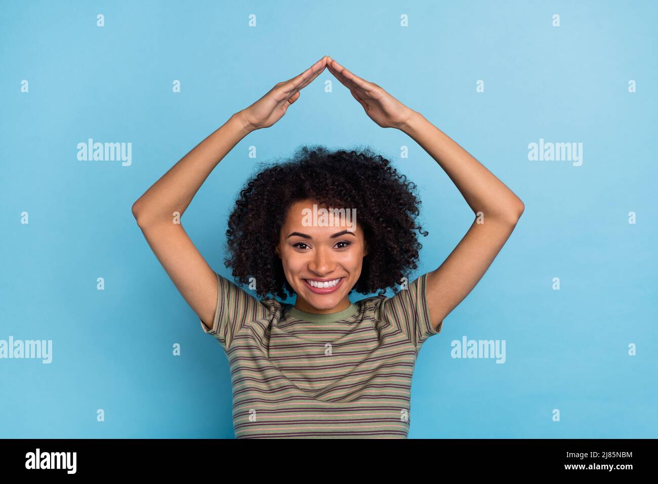 Photo of lady hands over head enjoy safe apartment building wear ...