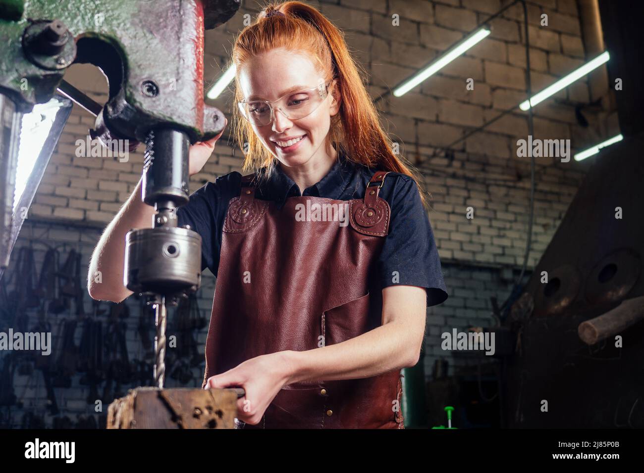 Woman blacksmith working in forge hi-res stock photography and images ...